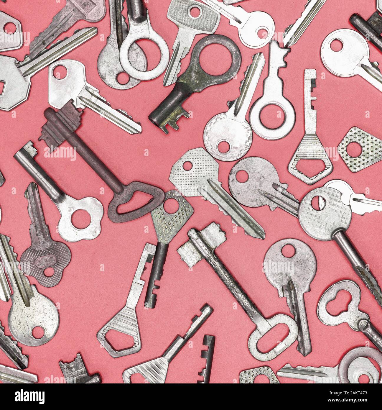 Keys set on pink background. Door lock keys and safes for property ...