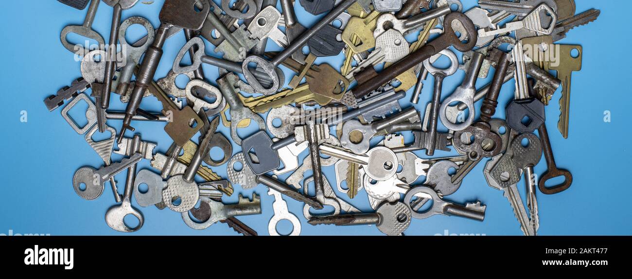 Keys set on blue background. Door lock keys and safes for property ...