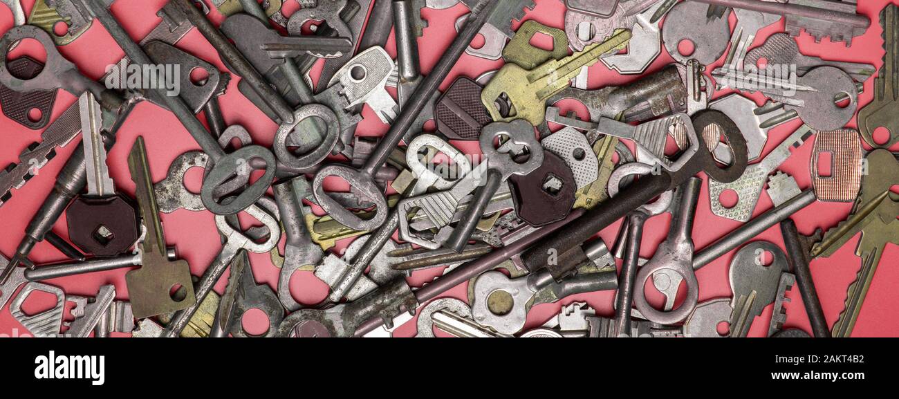 Keys set on pink background. Door lock keys and safes for property ...