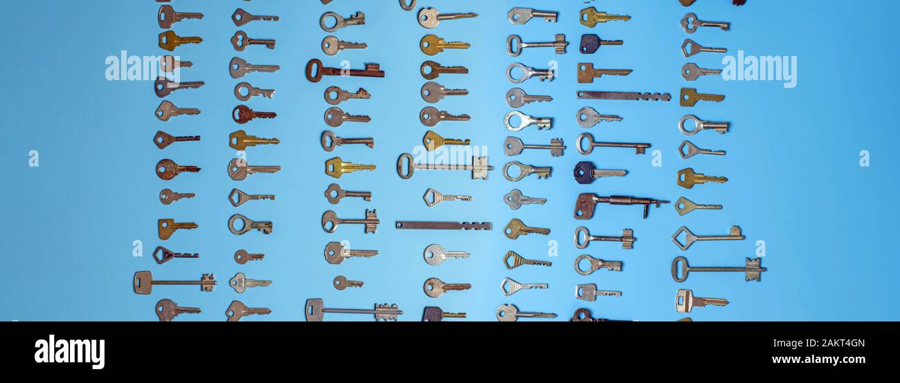 Keys set on blue background. Door lock keys and safes for property ...