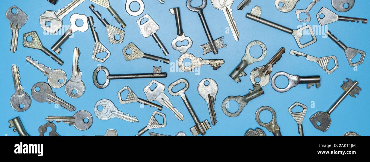 Keys set on blue background. Door lock keys and safes for property ...