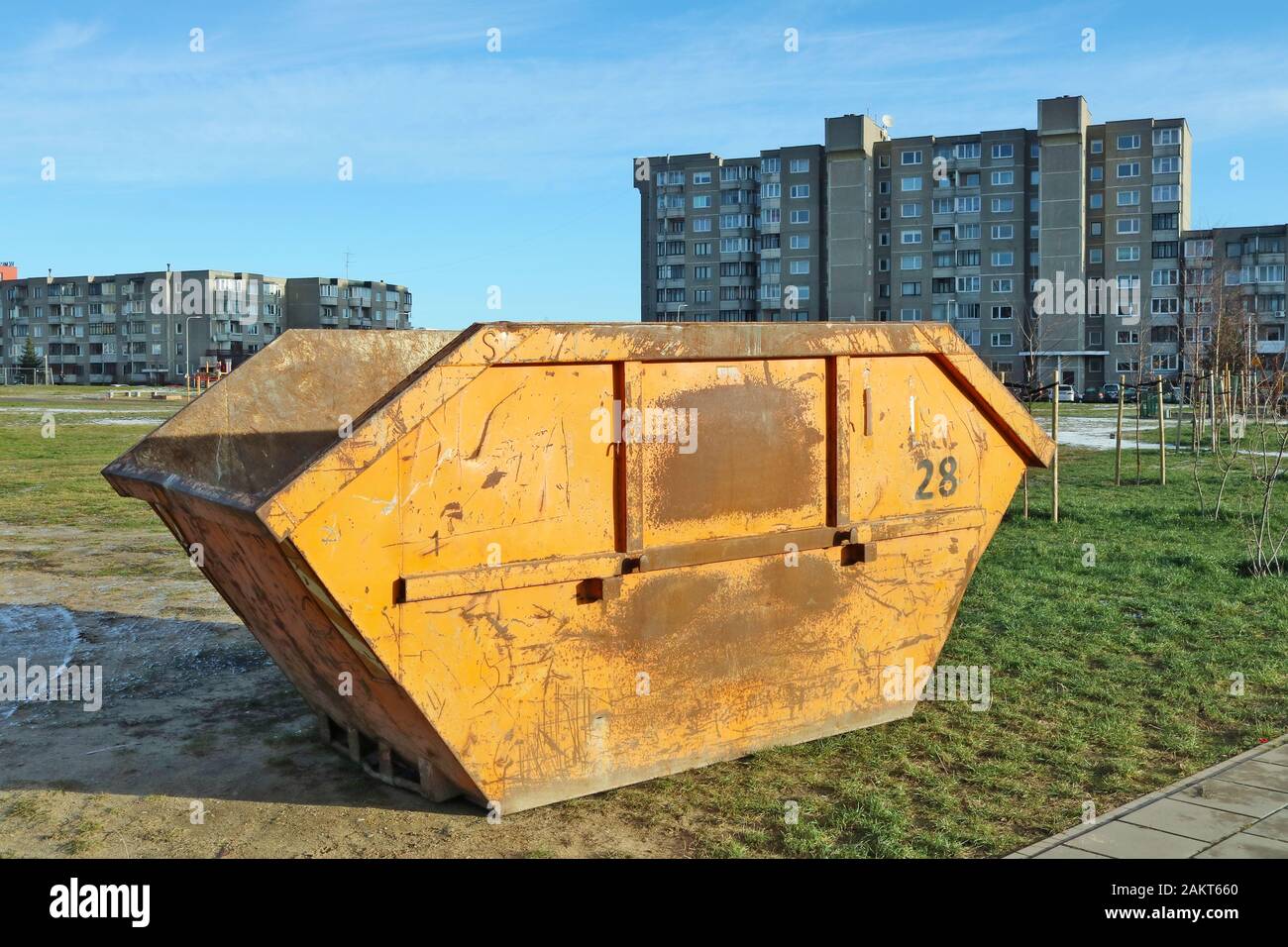 Orange rusty aged steel container for construction and industrial waste ...