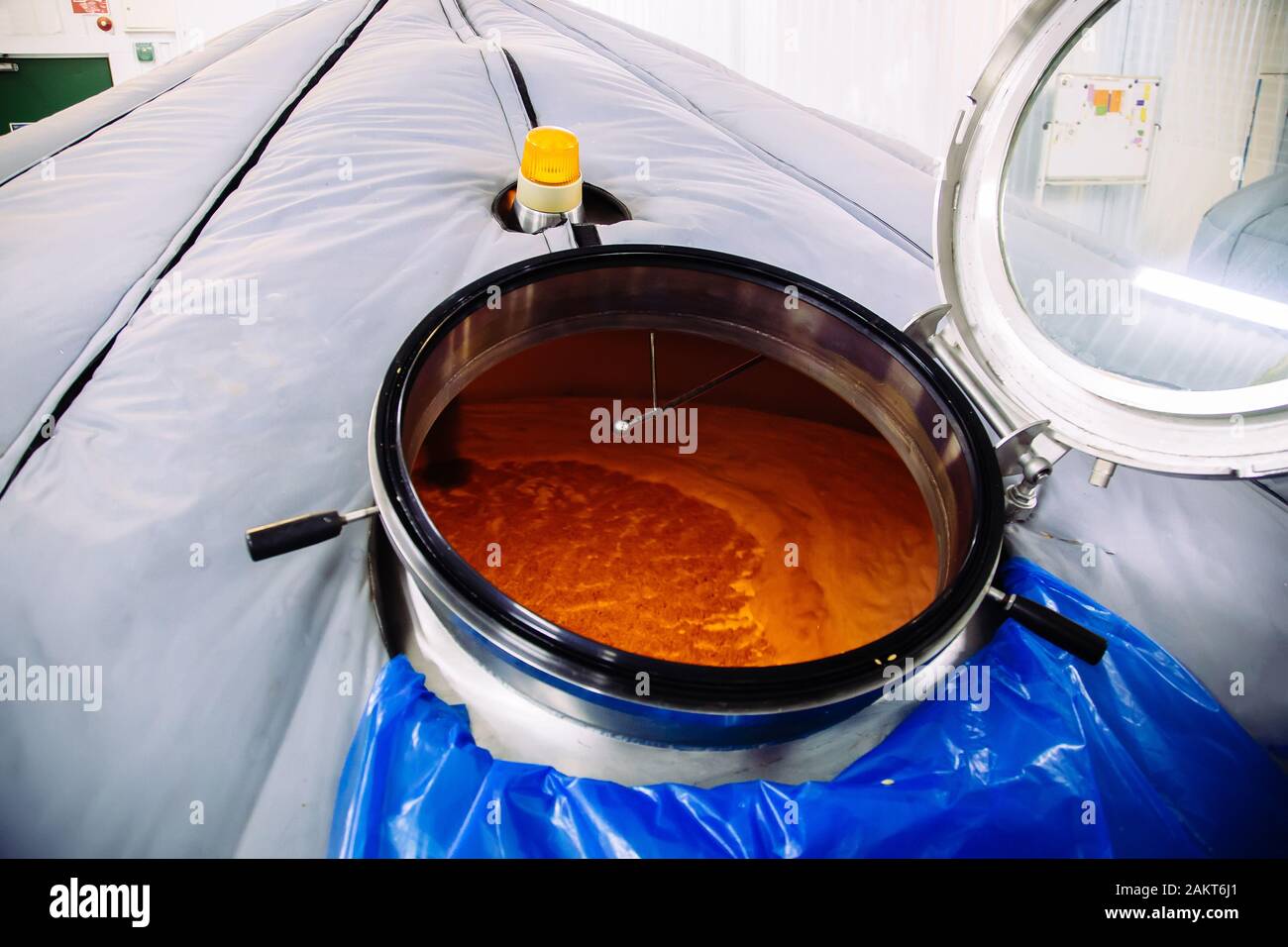 Opened brewing vat. Fermentation of beer wort inside Stock Photo - Alamy