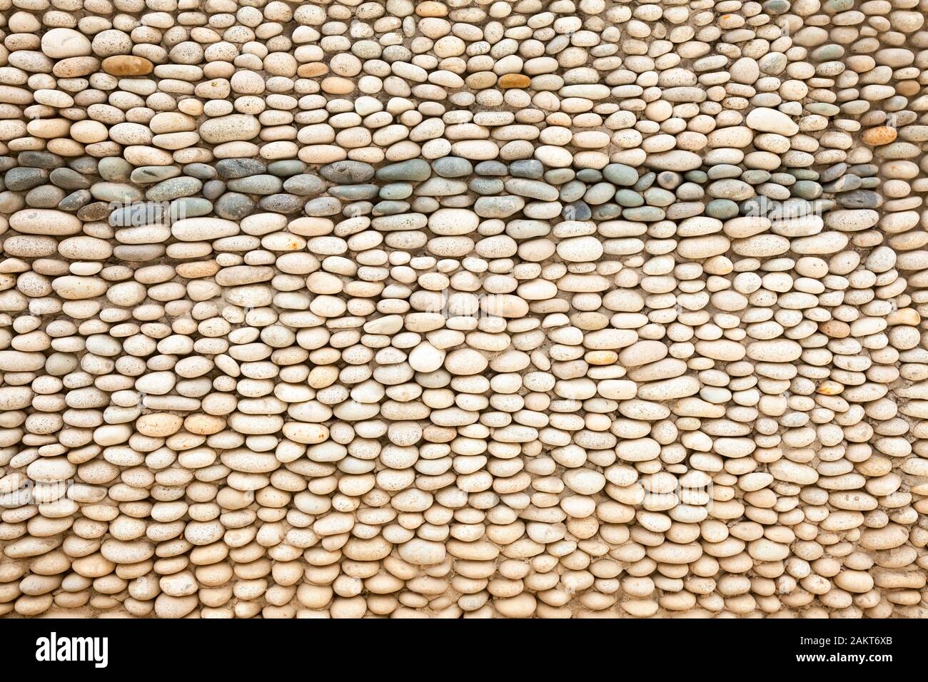 Stone wall made of cobblestones Stock Photo - Alamy