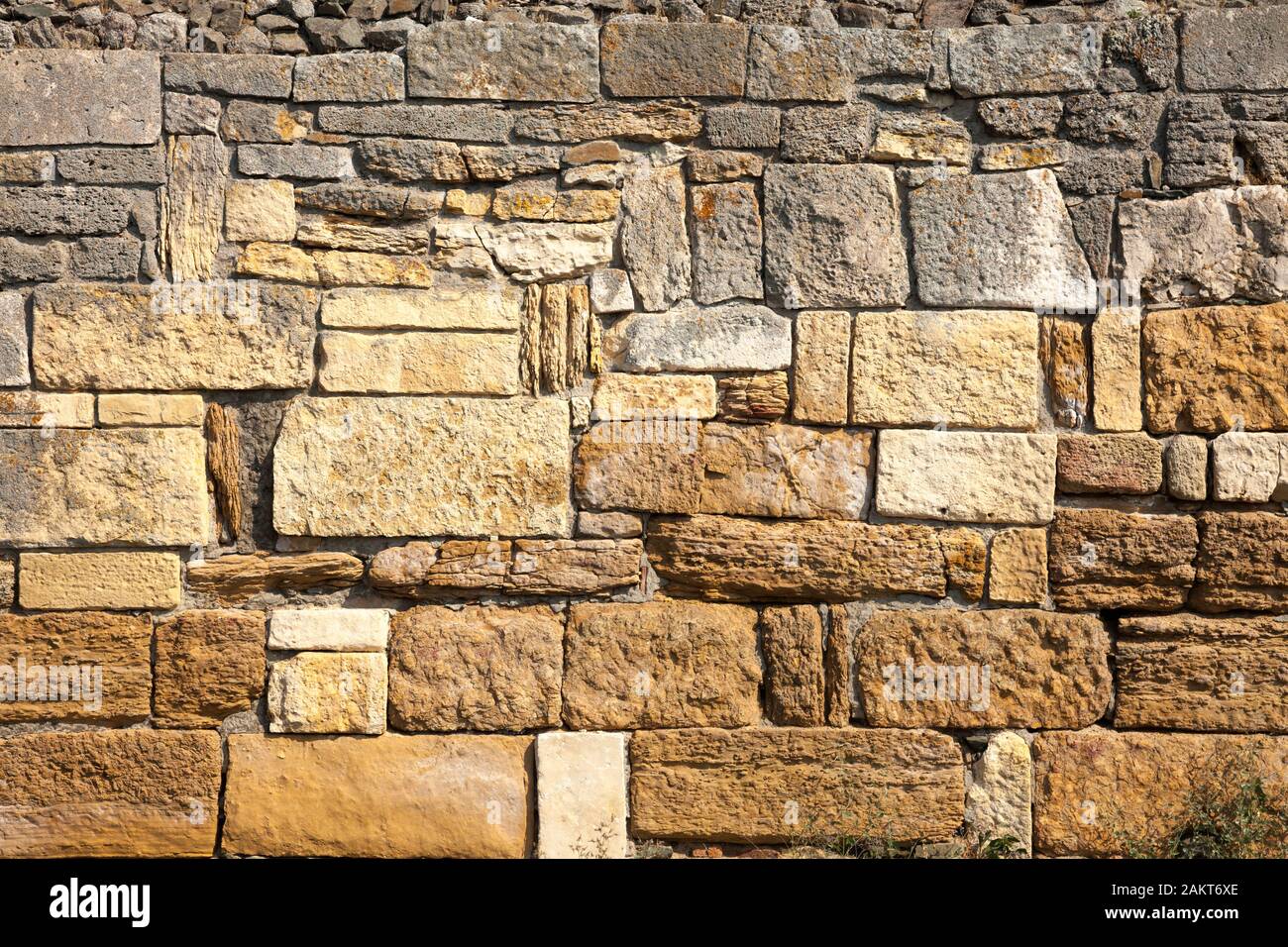 Old weathered stone wall background Stock Photo - Alamy