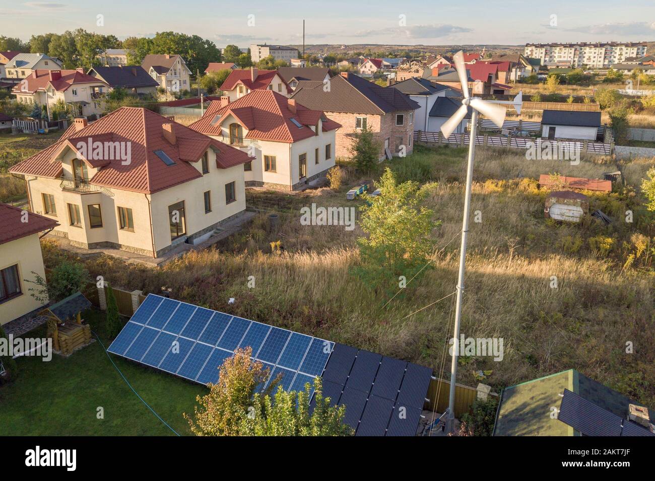 Aerial view of a residential private house with solar panels on roof ...