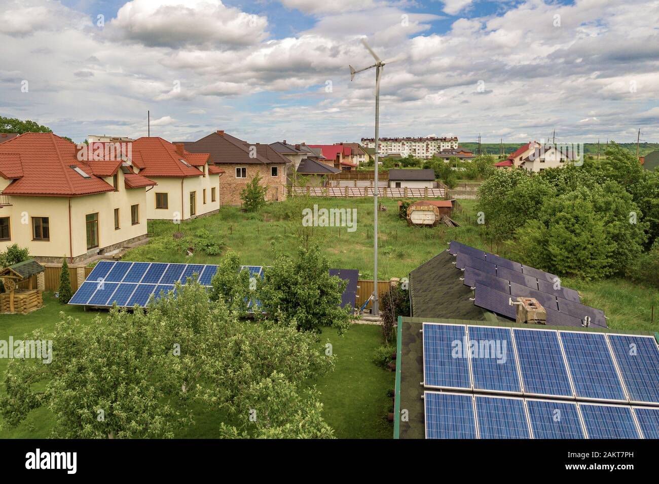 Aerial view of a residential private house with solar panels on roof ...