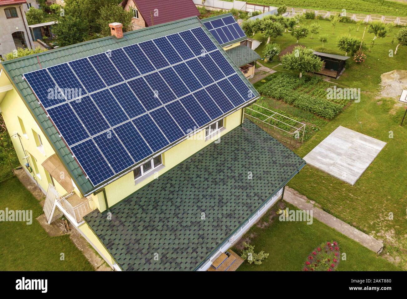 Aerial top view of new modern residential house cottage with blue shiny ...