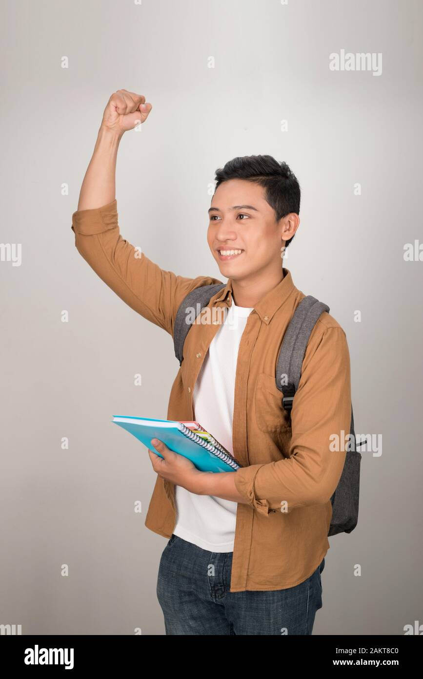 Handsome Asian excited student happy smile looking at camera, isolated ...