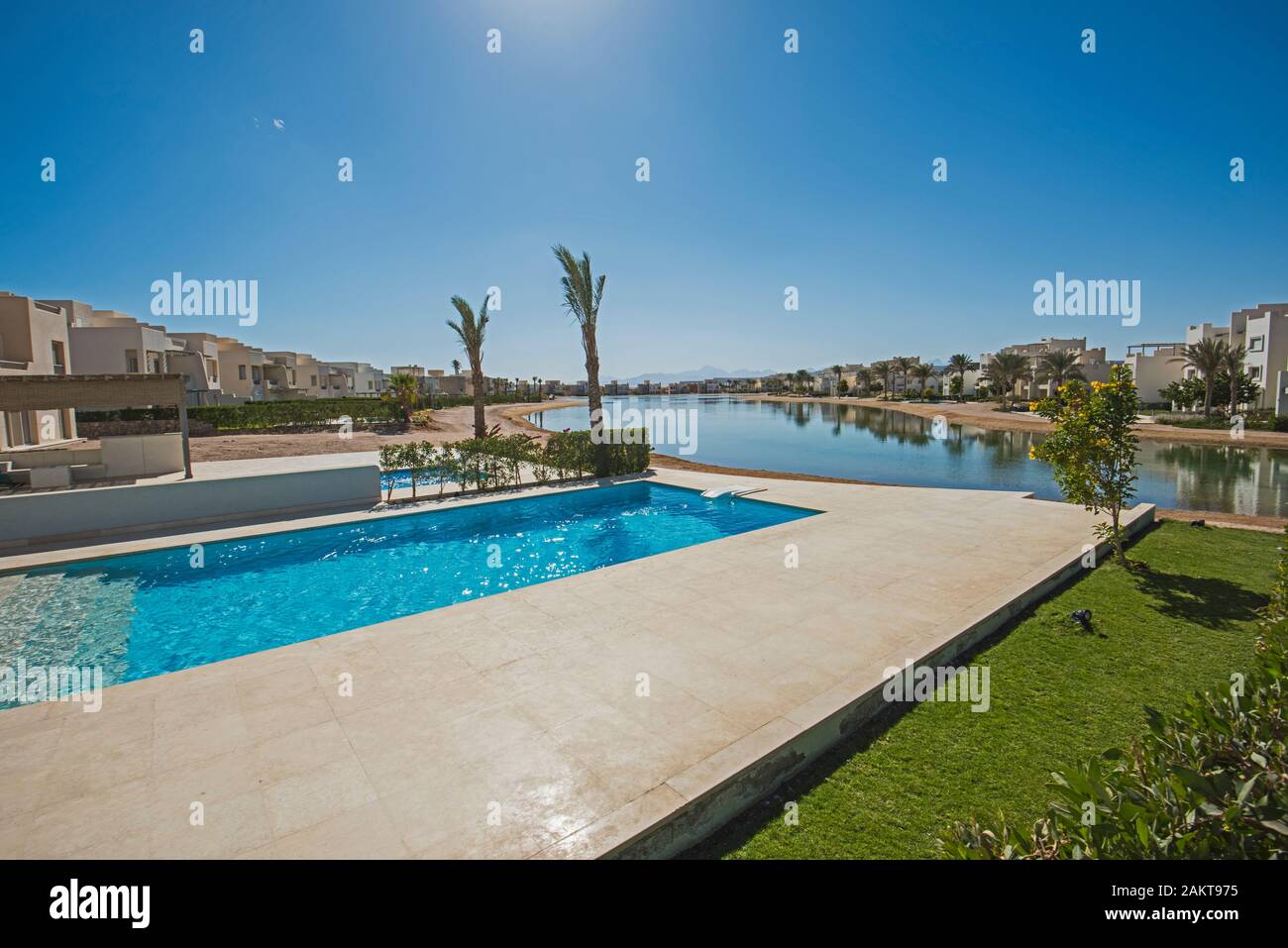 Luxury villa show home in tropical summer holiday resort with swimming ...