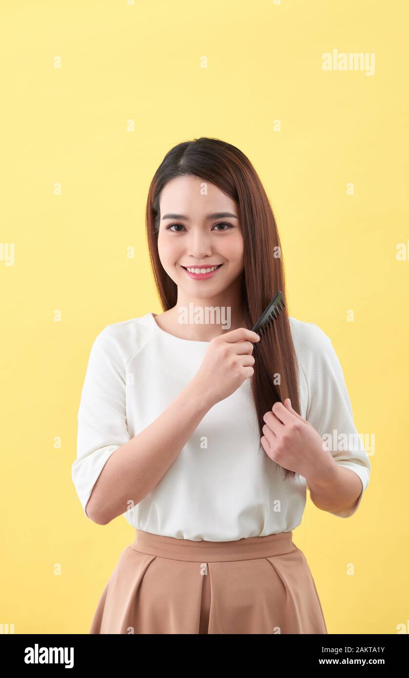 Beautiful female brushing his hair hi-res stock photography and images ...