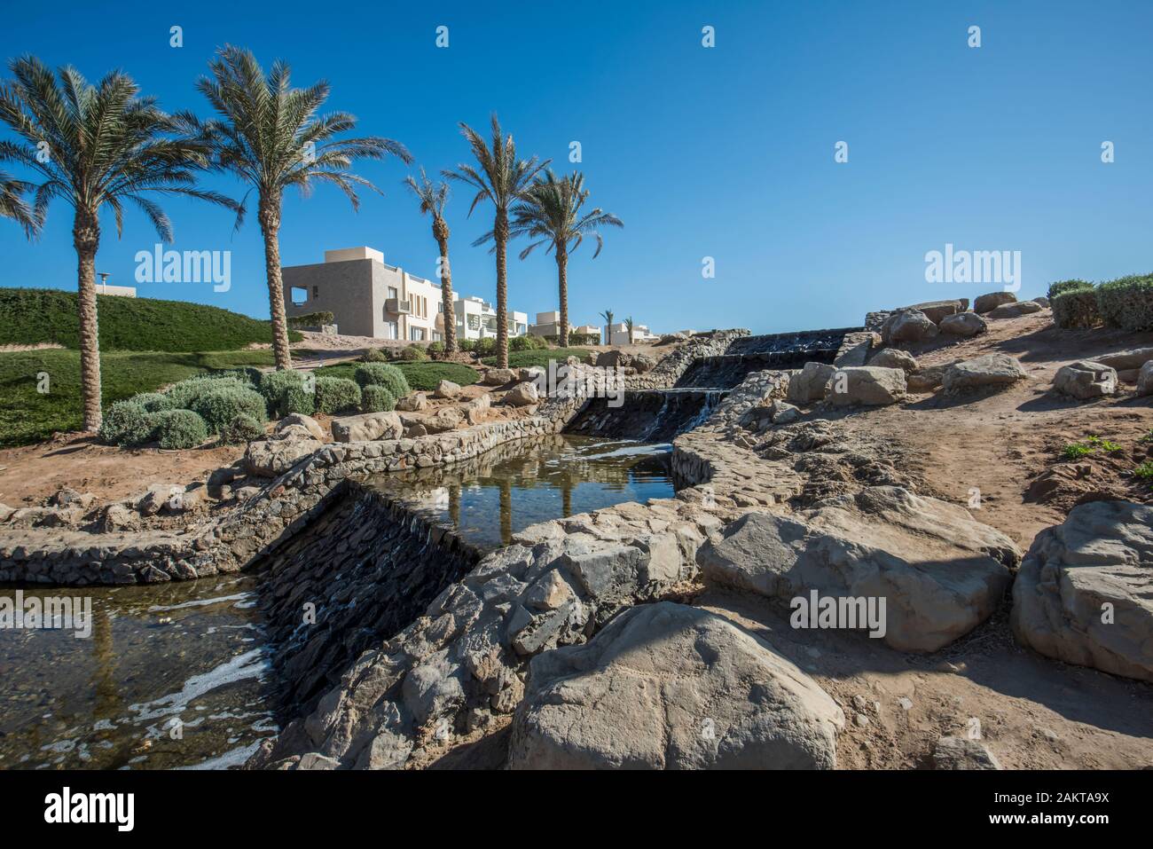 View of a luxury holiday villa in tropical resort with landscaped ...