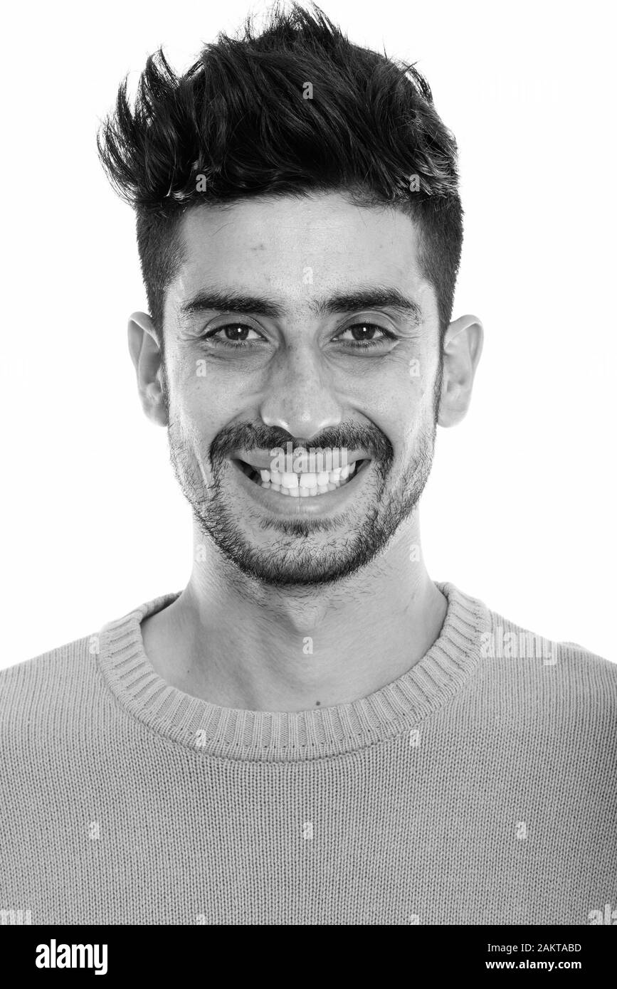 Face of young happy Persian man smiling Stock Photo - Alamy