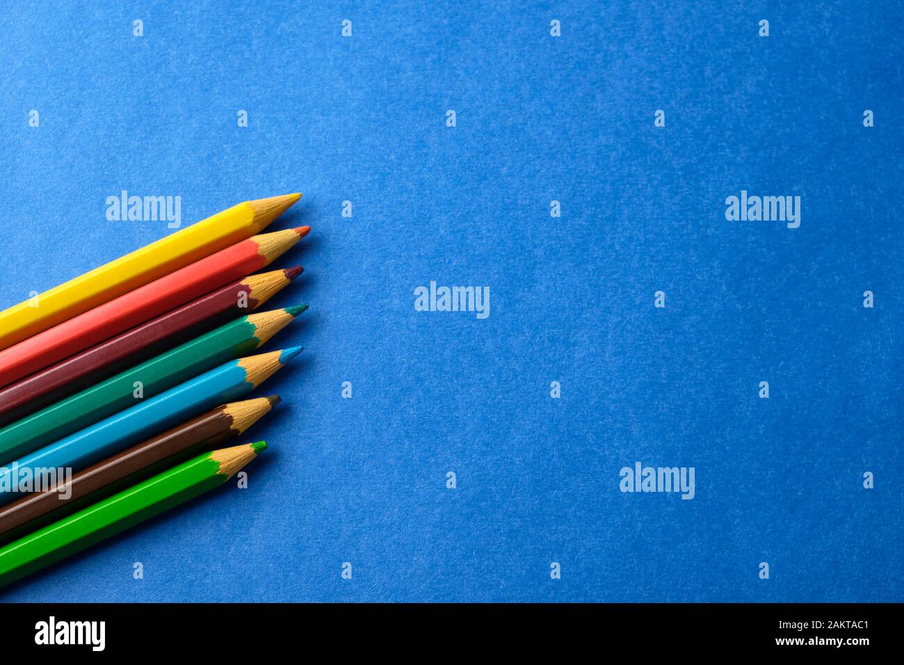 Multi colored crayons at blue background with copy space Stock Photo ...