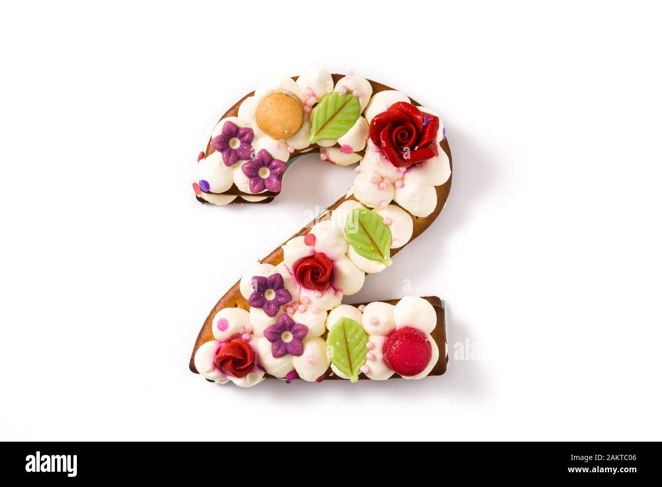 Number two cake decorated with flowers and macarons isolated on white ...