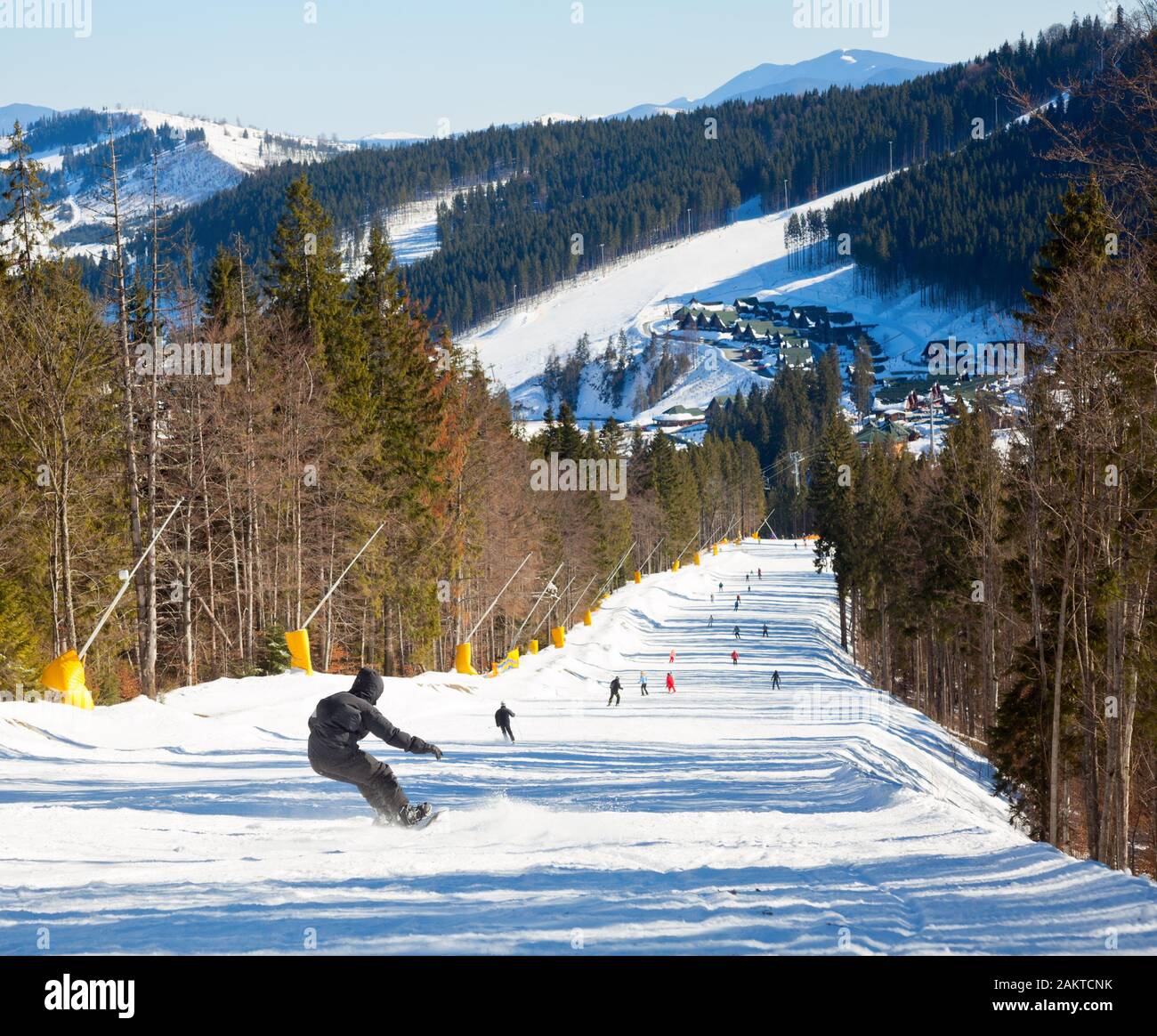 People riding down ski slope hi-res stock photography and images - Alamy