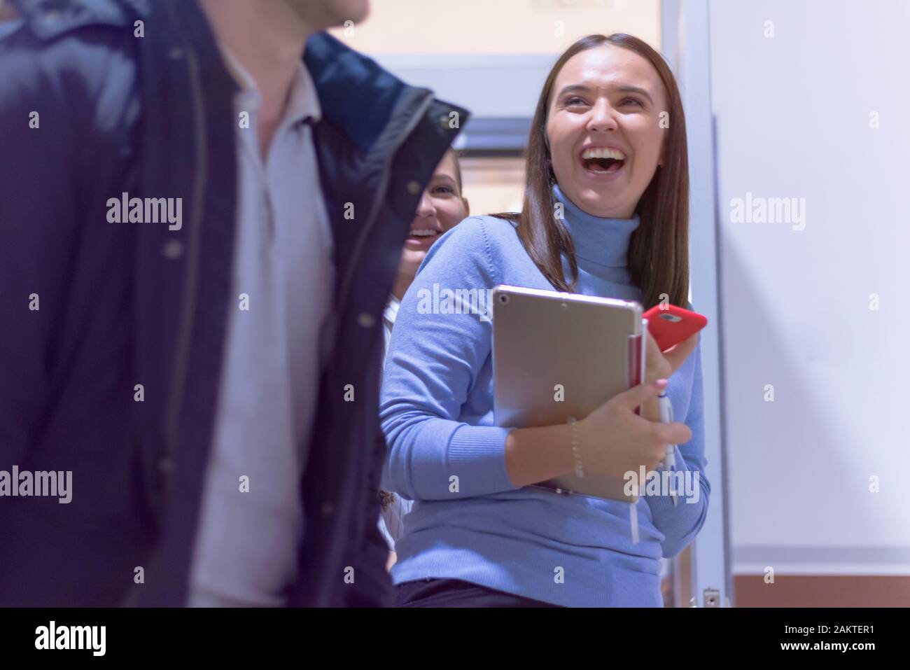 International group of students with going out from classroom at ...