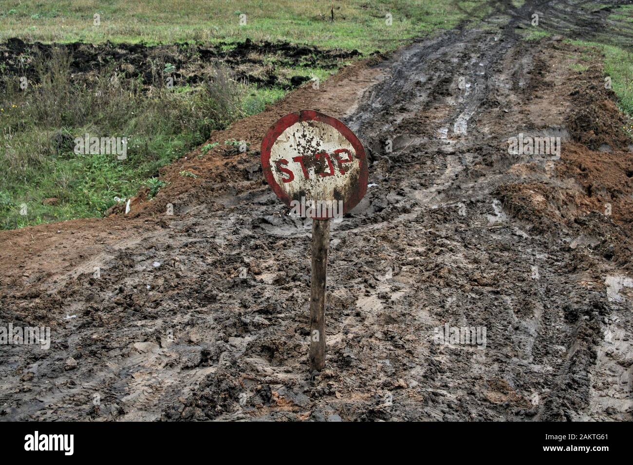 Old sign stop on dirt Russian rural road Stock Photo - Alamy