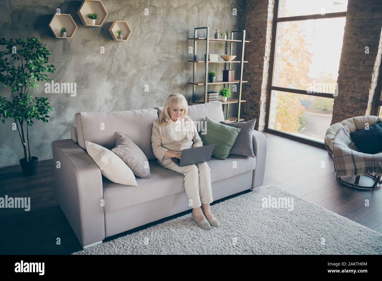 Nice attractive focused concentrated gray-haired blond middle aged ...