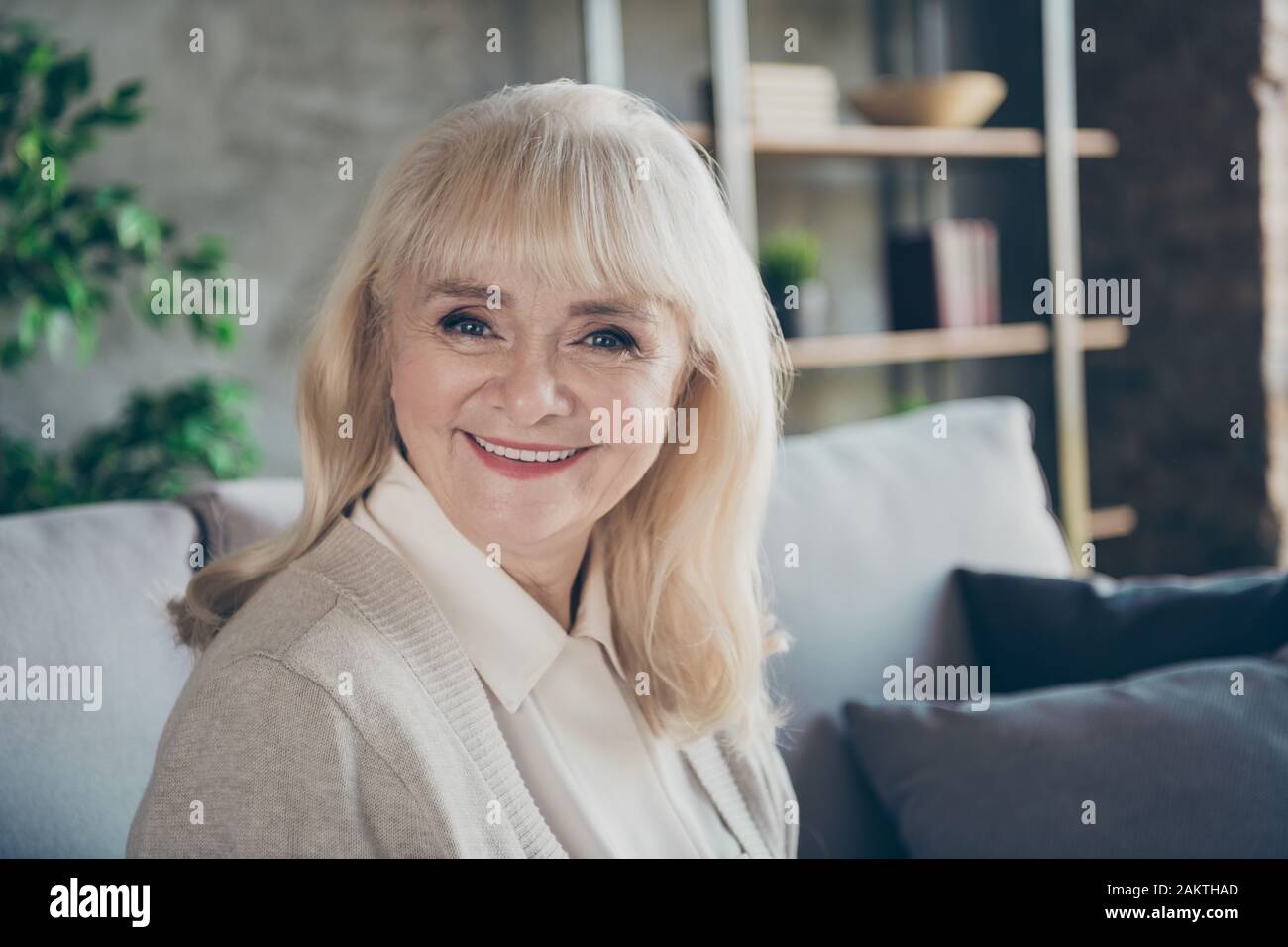 Closeup photo of amazing blond adorable aged granny homey good mood ...