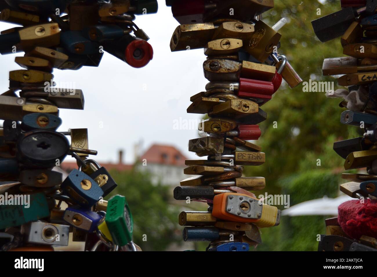 Many padlocks on the railing of a bridge that represent the eternal ...