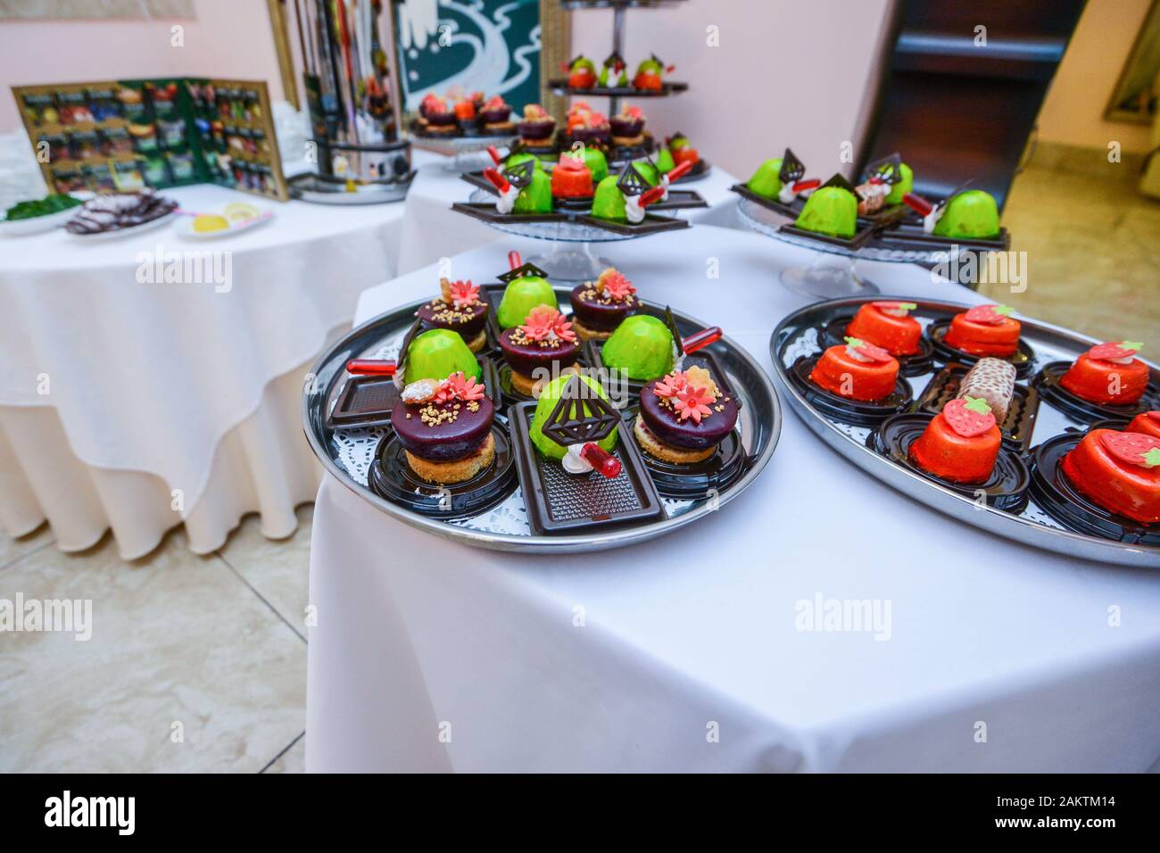 Different sort of beautiful pastry, small colorful sweet cakes Stock ...