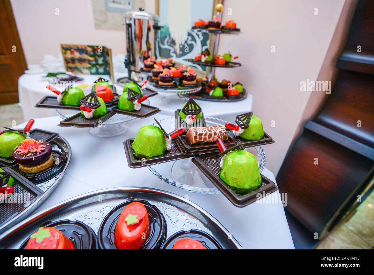 Different sort of beautiful pastry, small colorful sweet cakes Stock ...