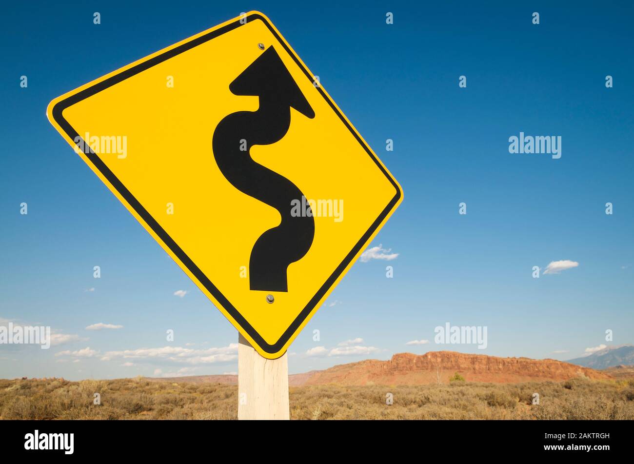 Blue curvy road ahead sign hi-res stock photography and images - Alamy