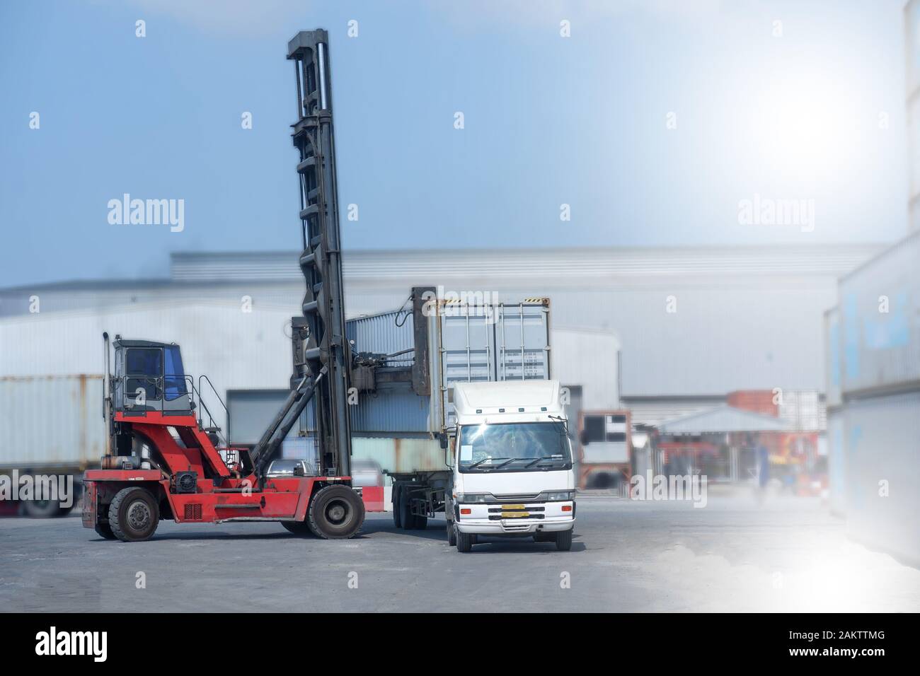 Container stacker, load the container into the truck. Transportation ...