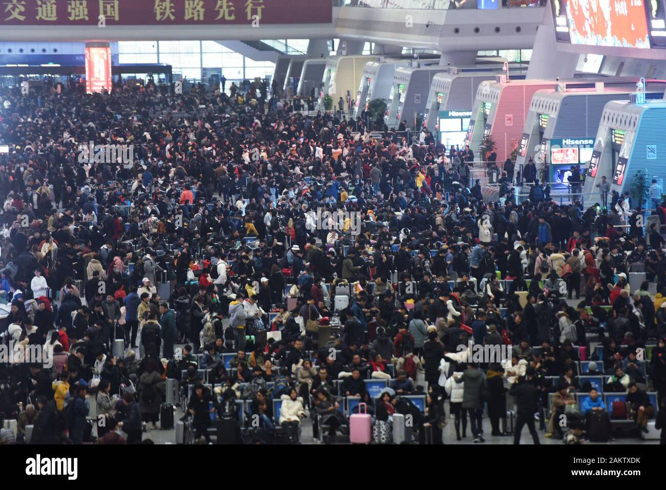 Chinese passengers crowd the terminal at the East Hangzhou Railway ...