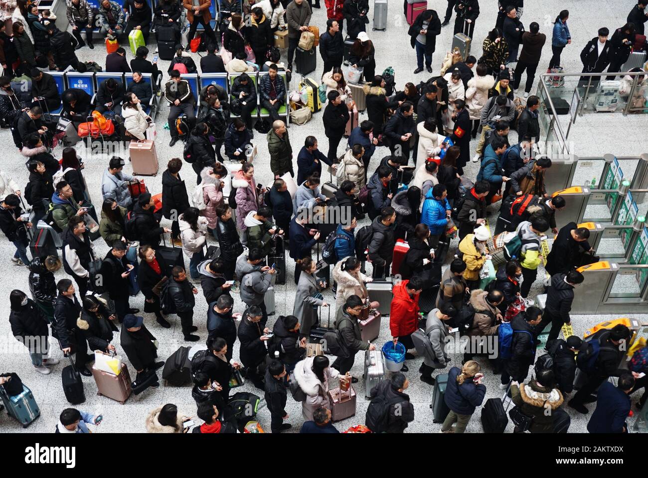 Chinese passengers crowd the terminal at the East Hangzhou Railway ...