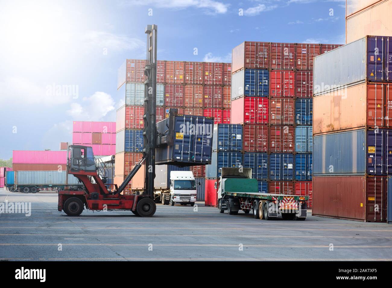 Container stacker, load the container into the truck. Transportation ...