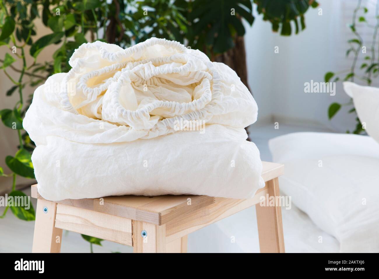 natural eco-friendly linen bed in the interior Stock Photo - Alamy