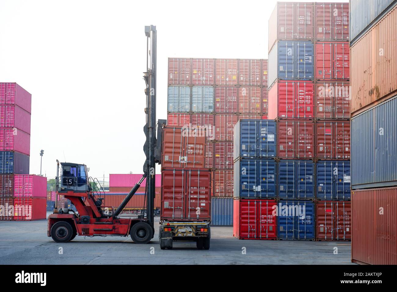 Container stacker, load the container into the truck. Transportation ...
