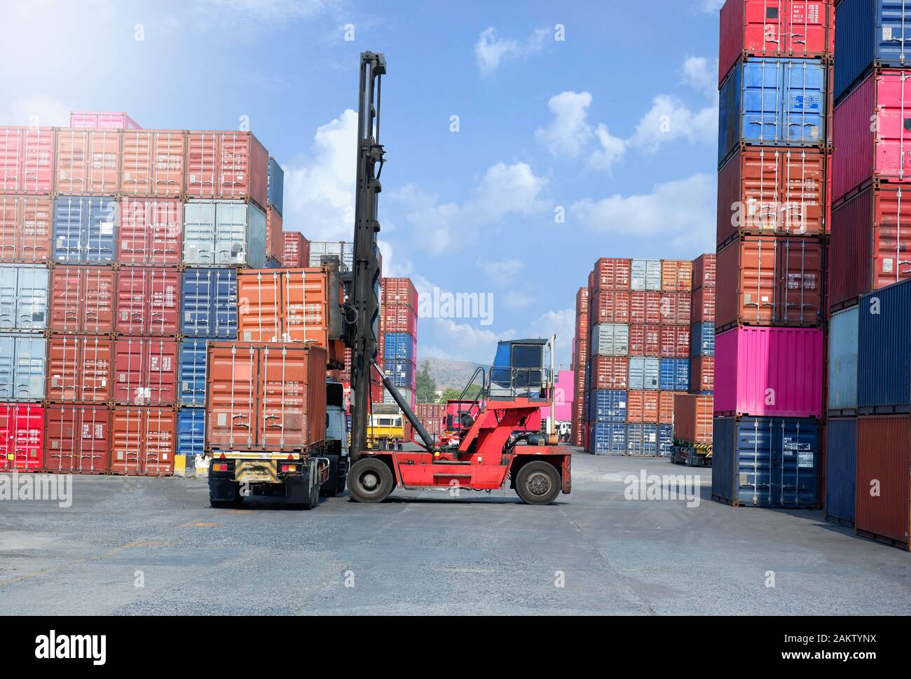 Container stacker, load the container into the truck. Transportation ...