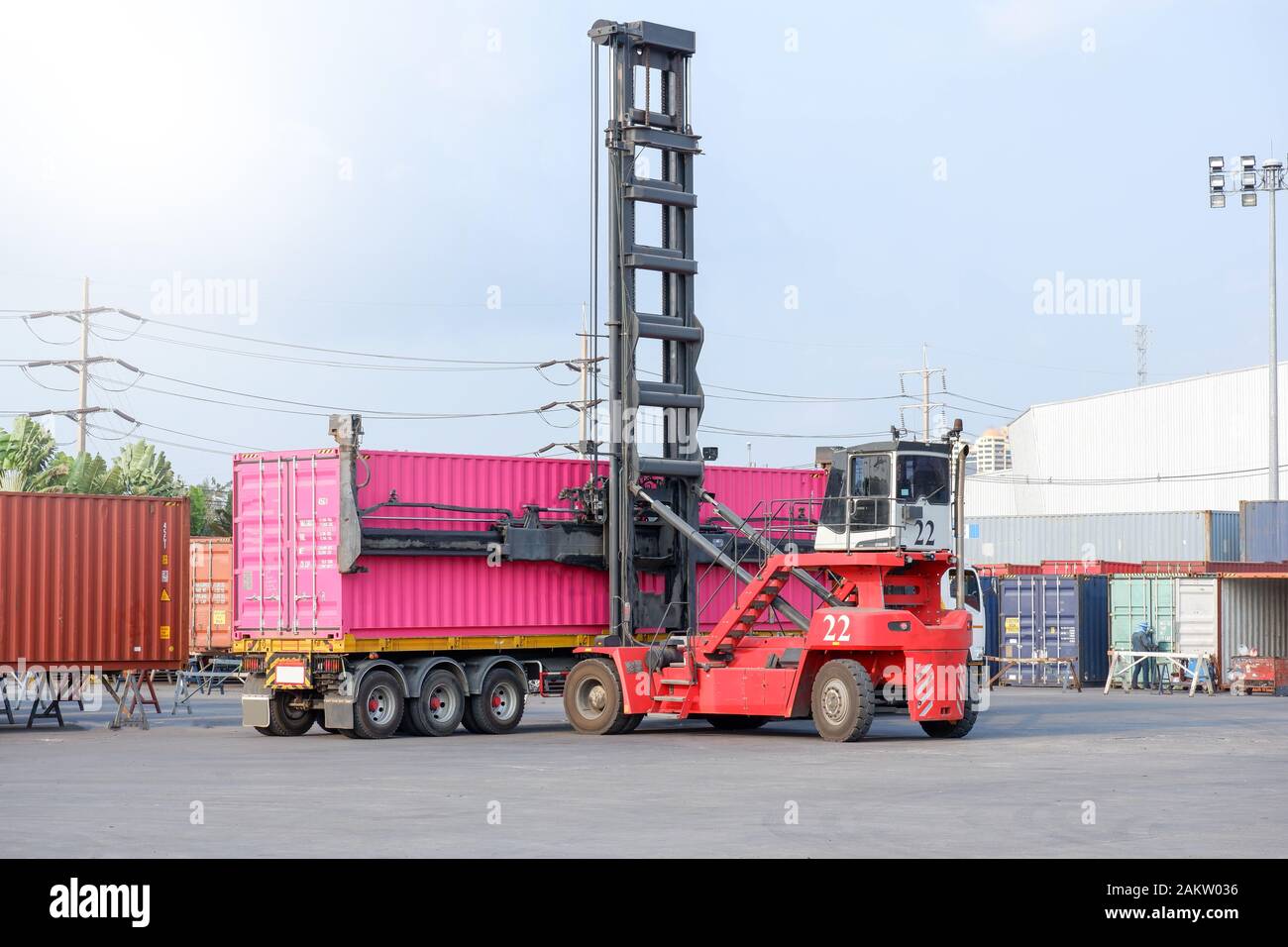 Container stacker, load the container into the truck. Transportation ...