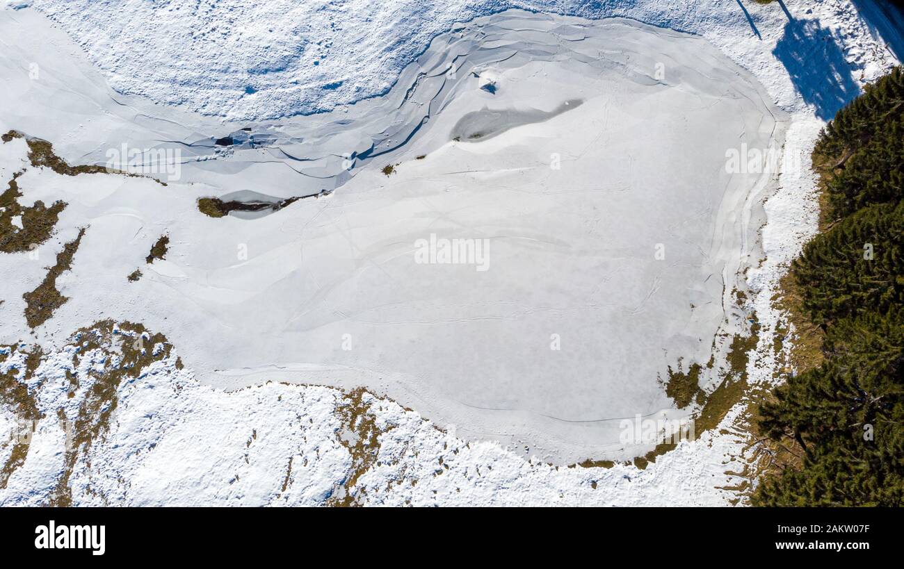 Aerial drop down view of frozen lake Stock Photo - Alamy