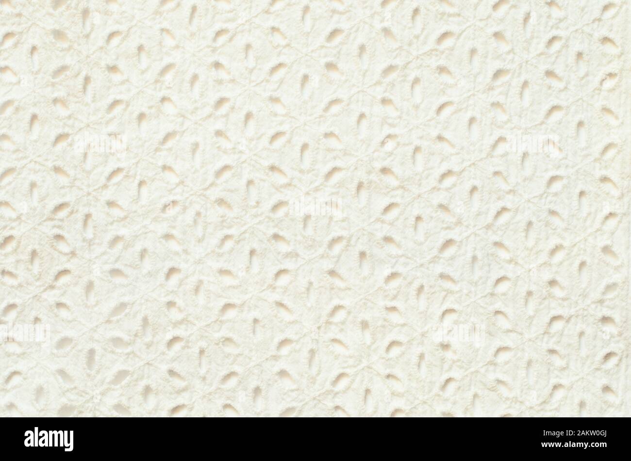 White embroidered fabric on white background Stock Photo - Alamy