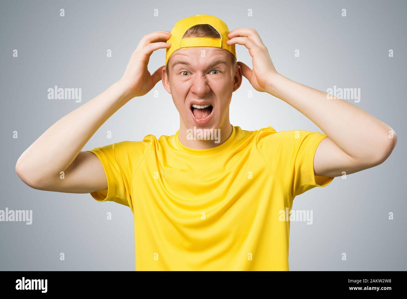 Stressful teenager screaming with panic Stock Photo - Alamy