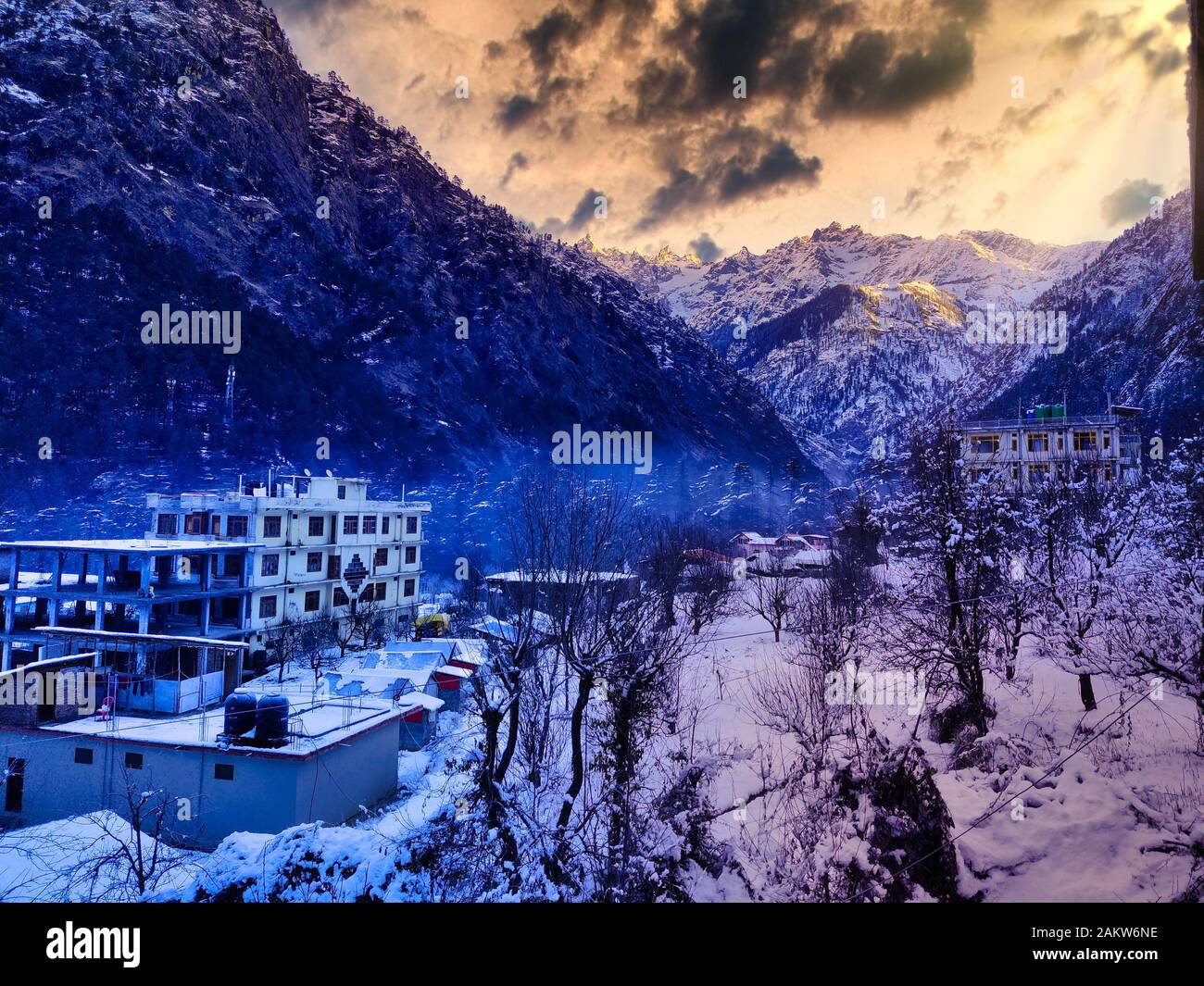 Photograph of a Building in the middle of the mountains covered with a ...