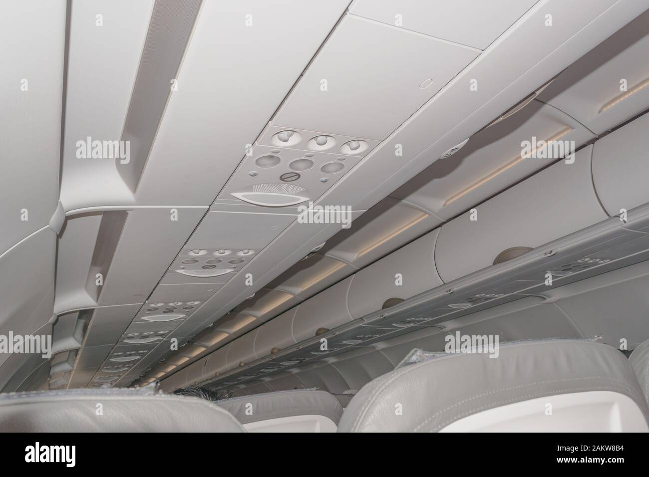 The ceiling interior of an airplane with luggage space. noise Stock ...