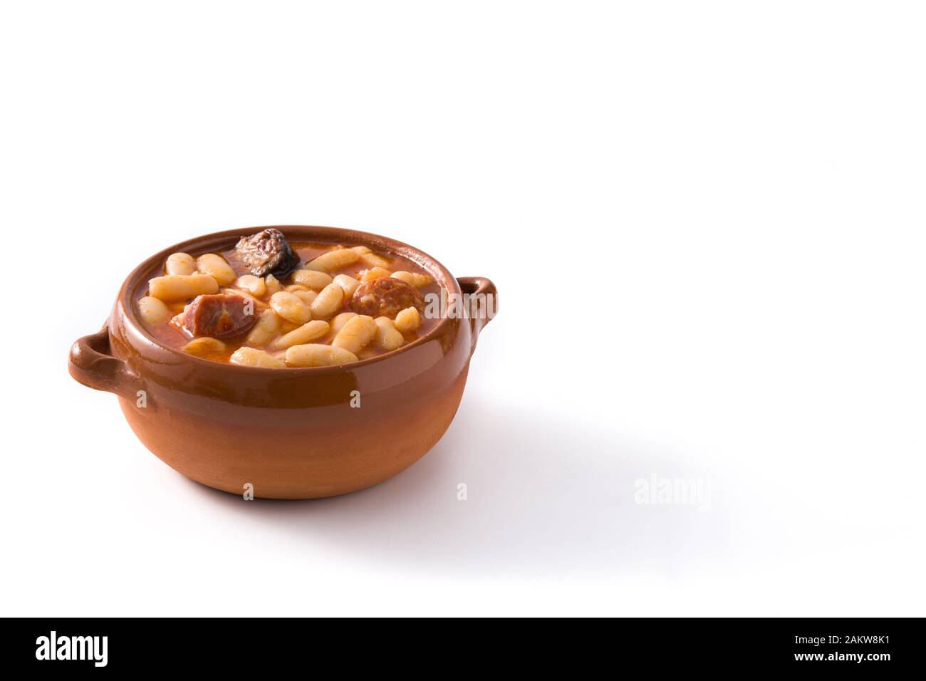 Typical Spanish fabada asturiana isolated on white background. Copy ...