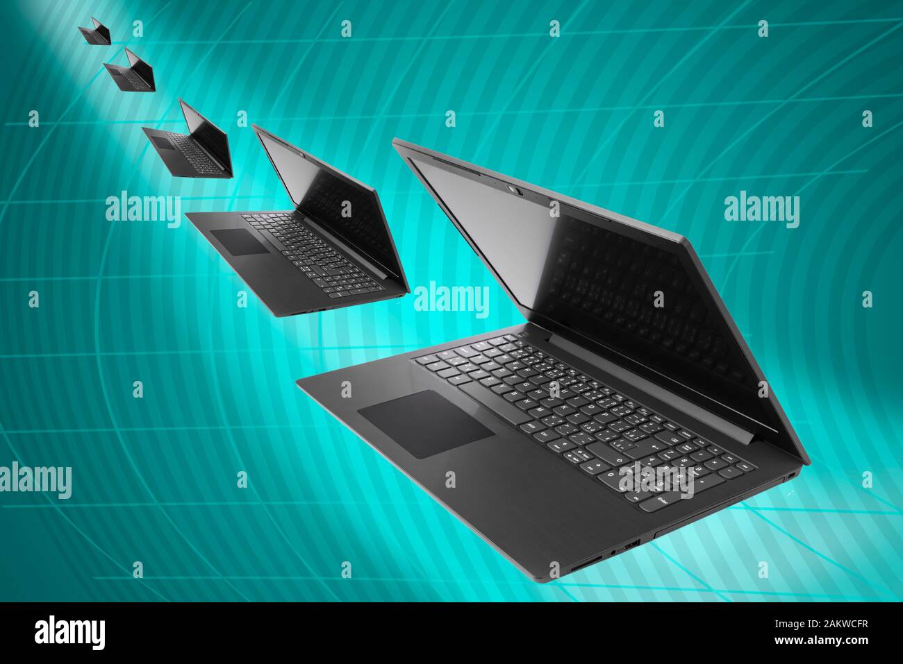 Modern slim laptop on a turquoise background Stock Photo - Alamy