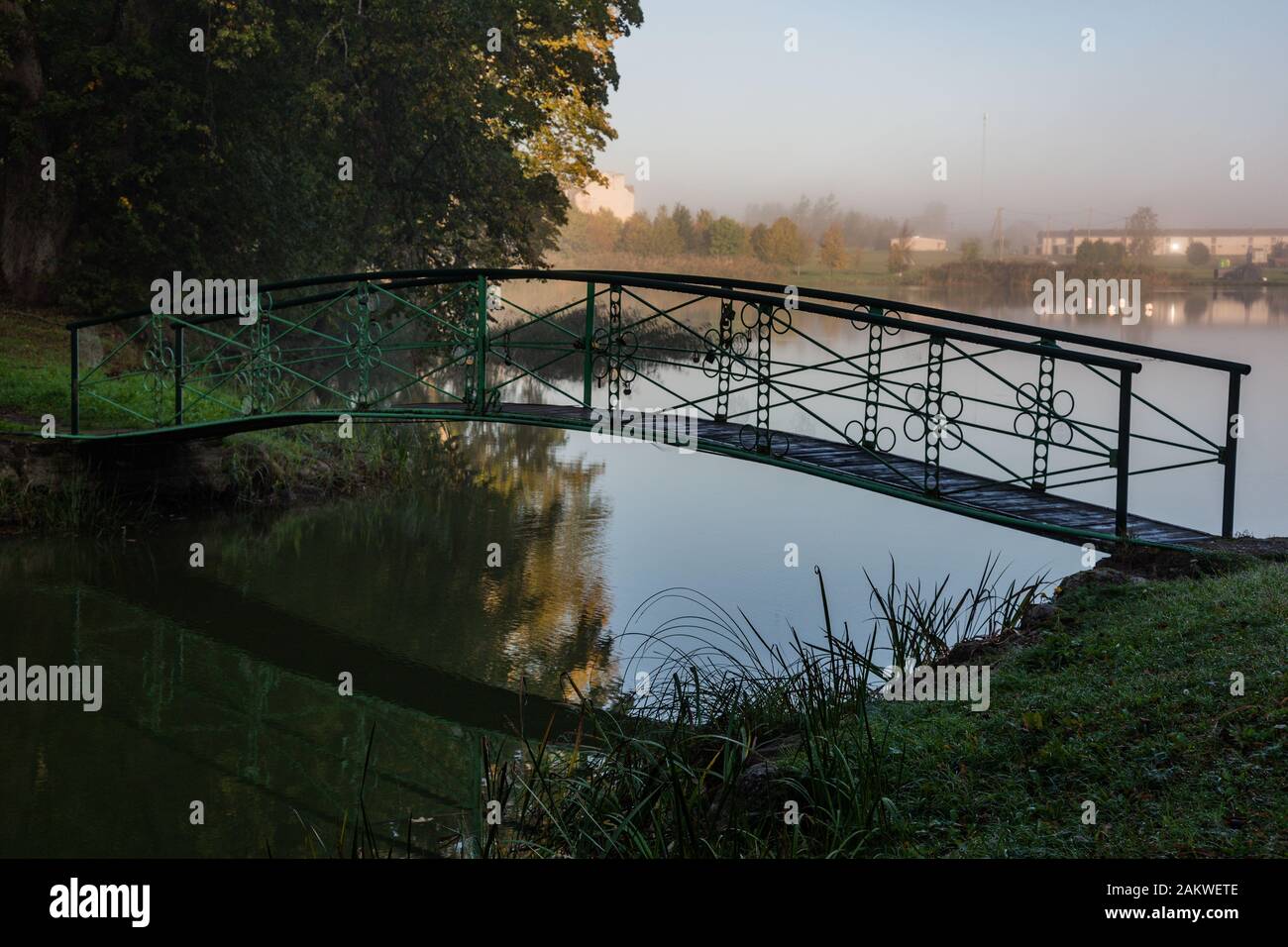 Beautiful arch bridge above small river Stock Photo - Alamy