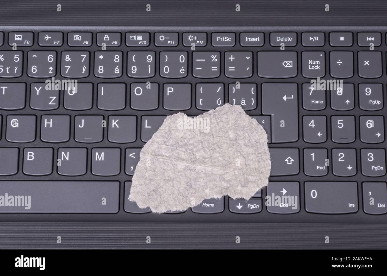 Modern slim laptop with ripped piece of paper Stock Photo - Alamy