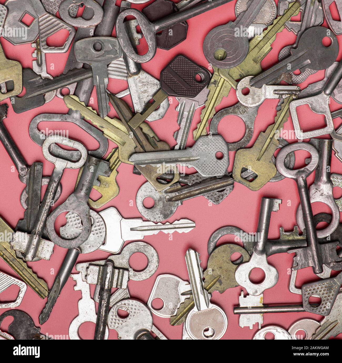 Keys set on pink background. Door lock keys and safes for property ...