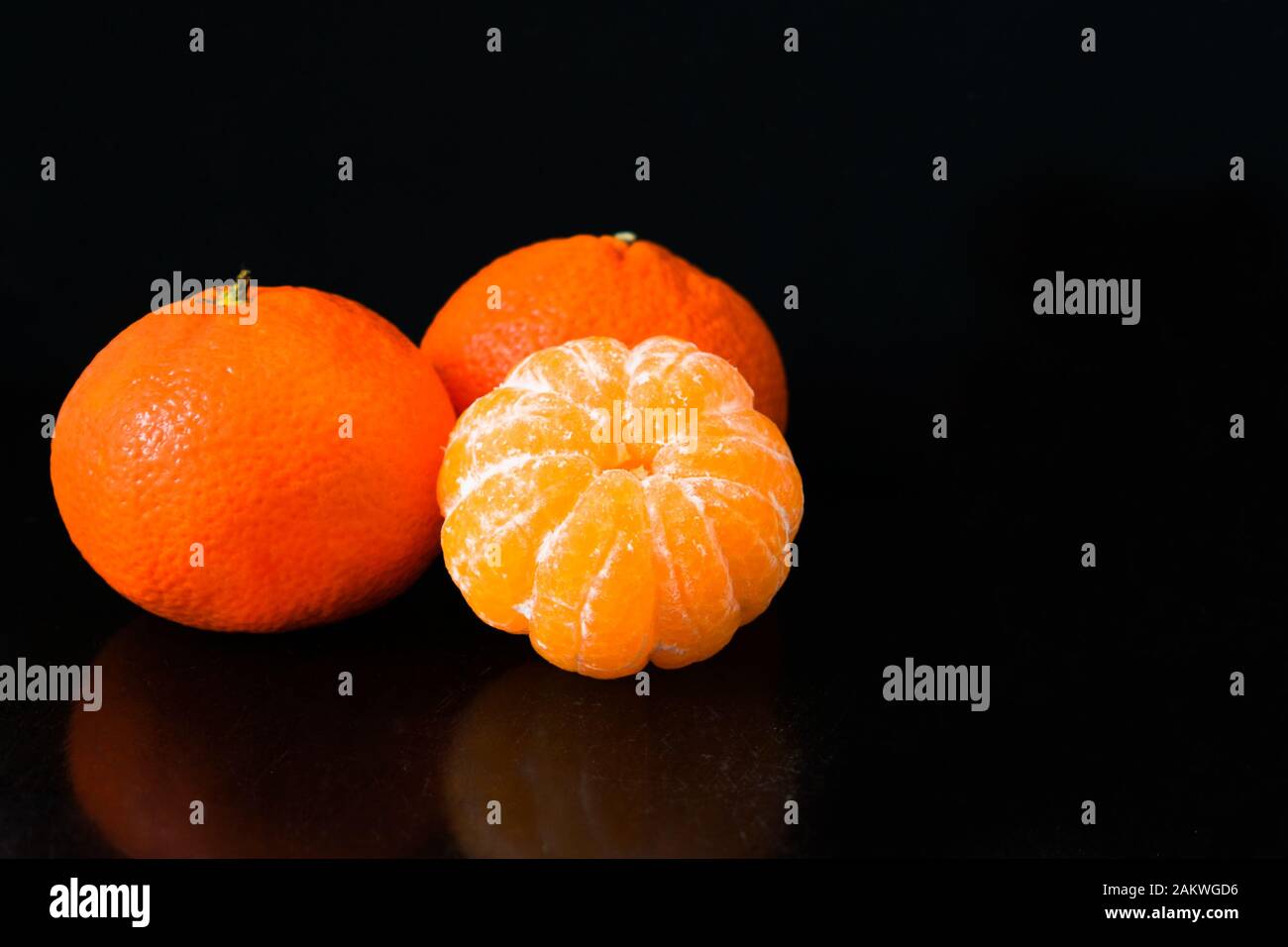 Tangerines isolated on black background. Copy space Stock Photo - Alamy