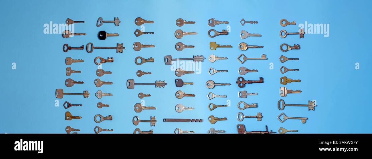 Keys set on blue background. Door lock keys and safes for property ...