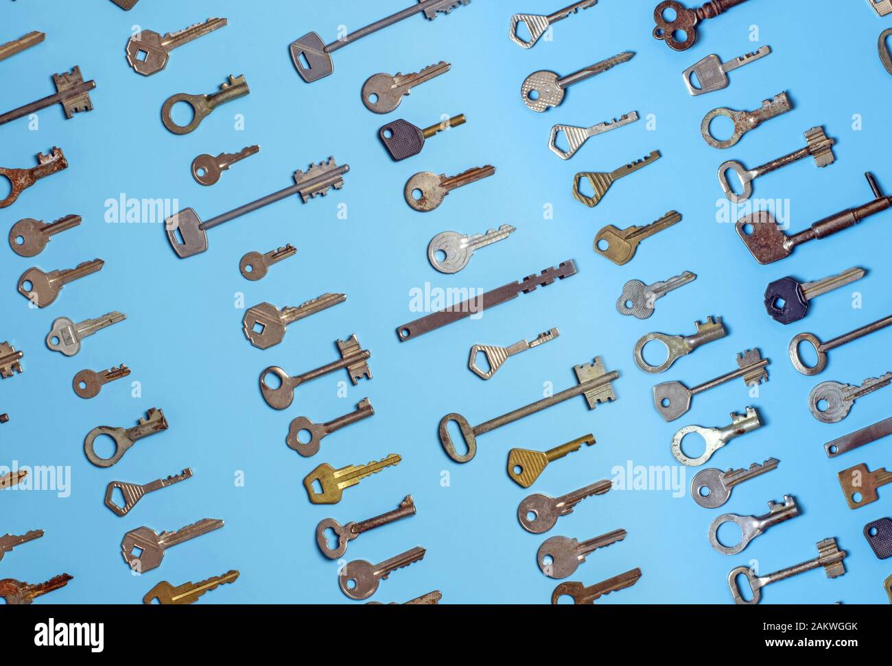 Keys set on blue background. Door lock keys and safes for property ...