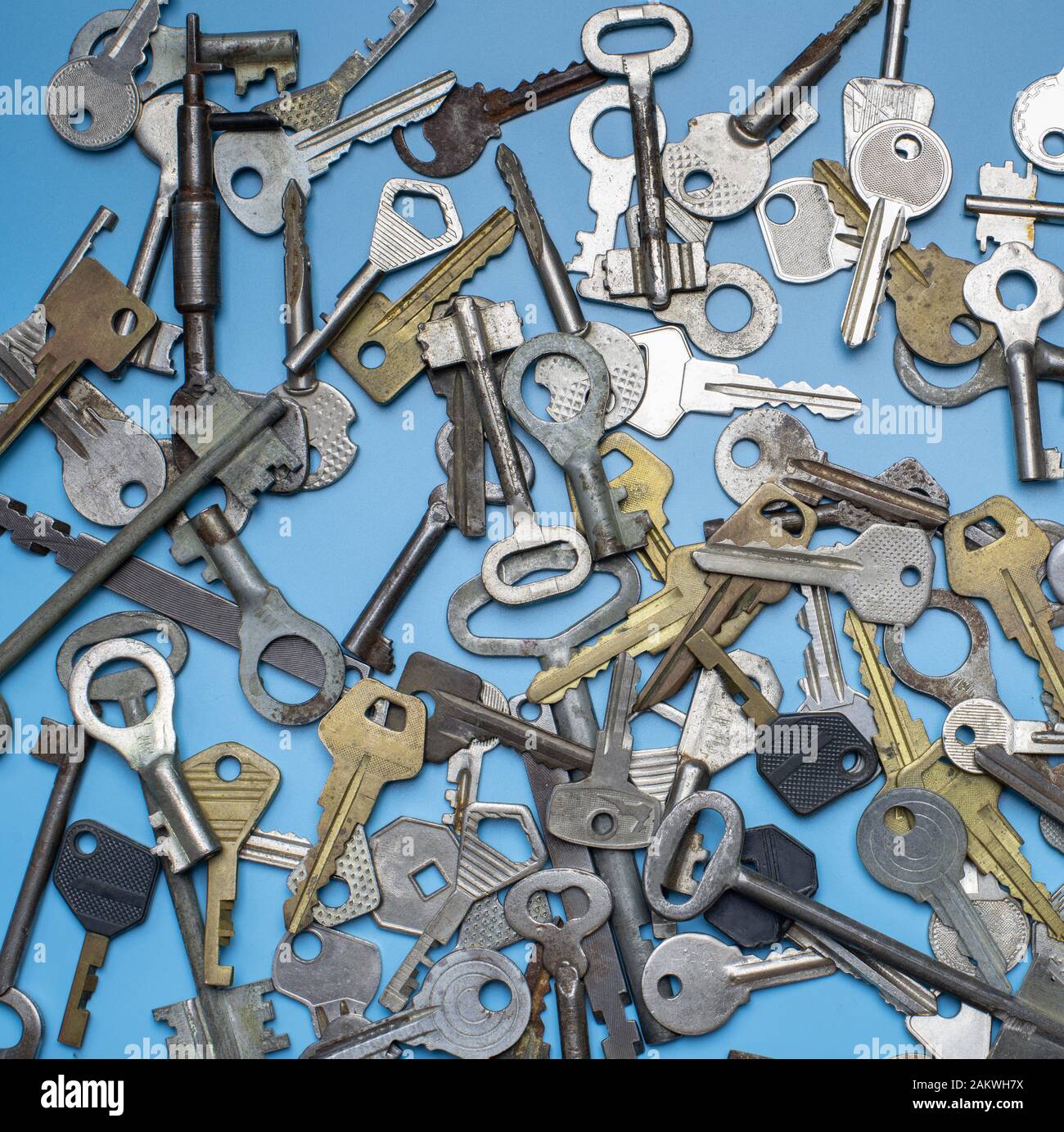 Keys set on blue background. Door lock keys and safes for property ...